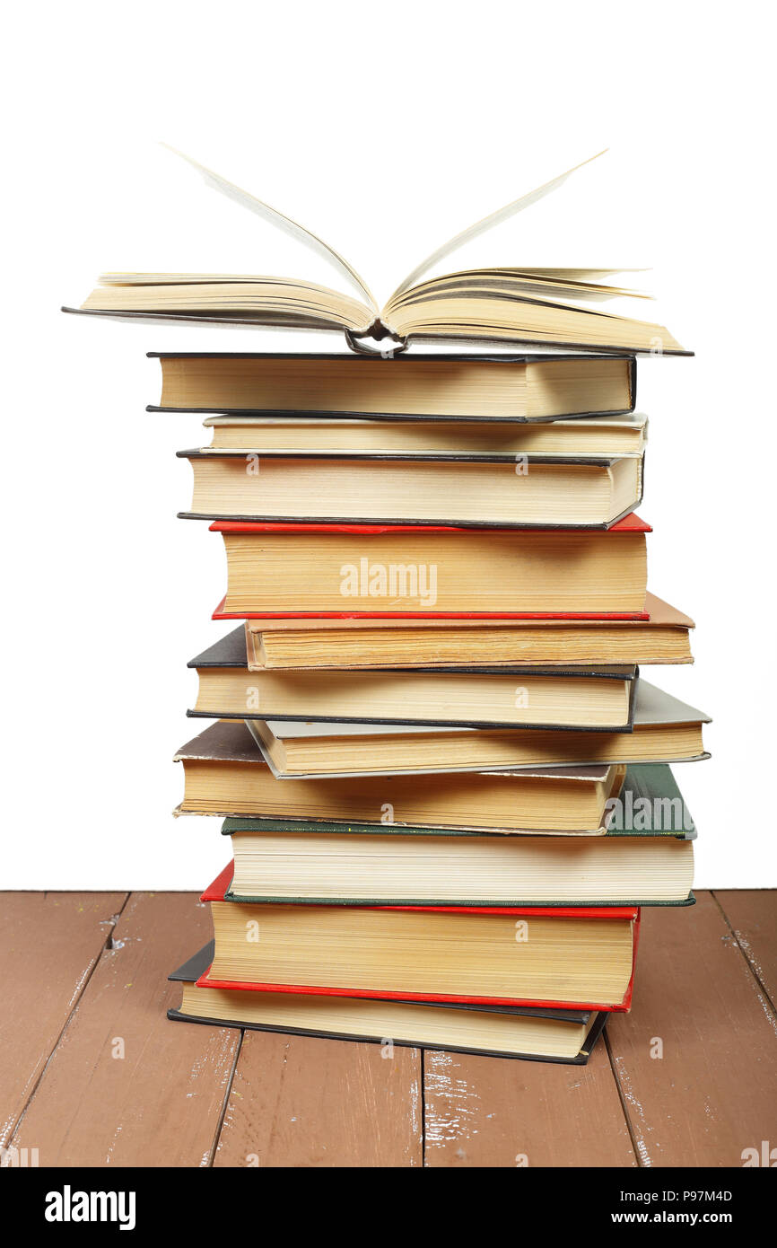 Science and education - Pile group of red books one open top front view ...