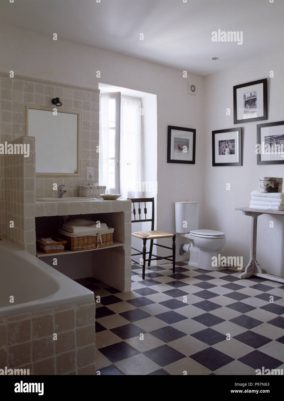 Black+white chequerboard floor in white Provencal bathroom with modern ...