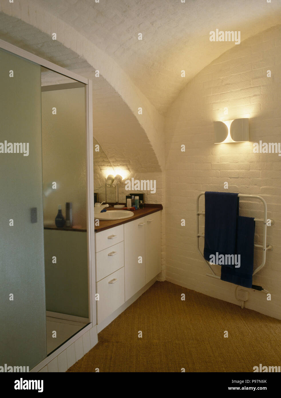 Modern white bathroom in converted Martello Tower Stock Photo - Alamy