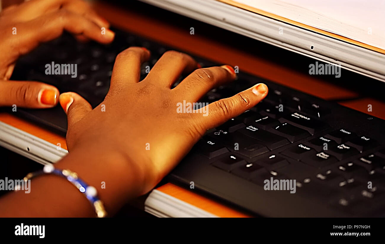 female hands busy typing on a computer keyboard Stock Photo - Alamy