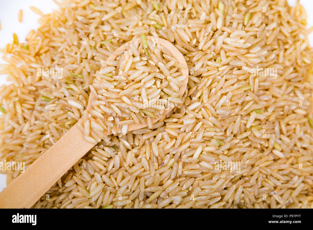 Brown Rice from Above with Wood Spoon Stock Photo - Alamy