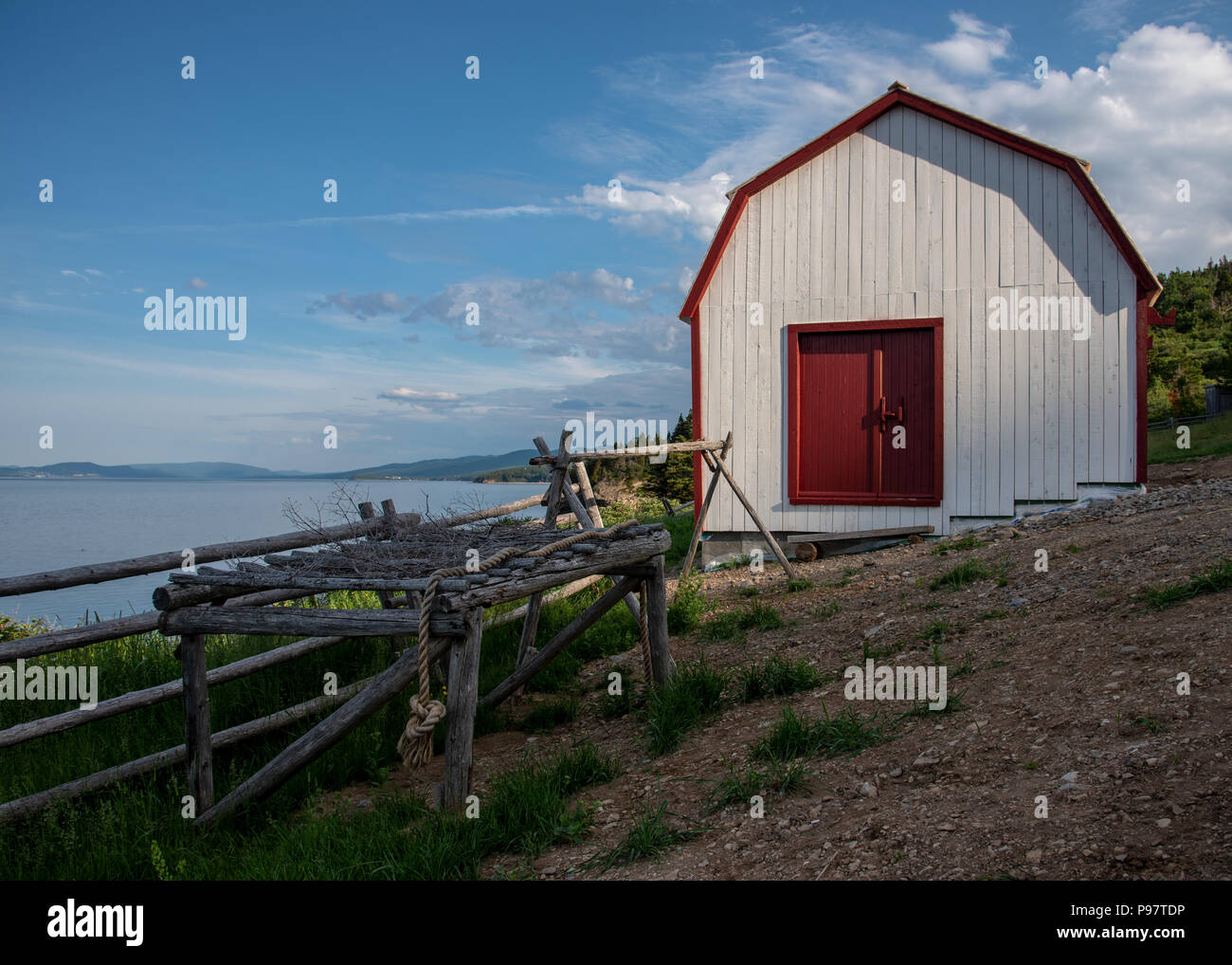 Old-fashioned barn with cod fish drying rack Stock Photo - Alamy