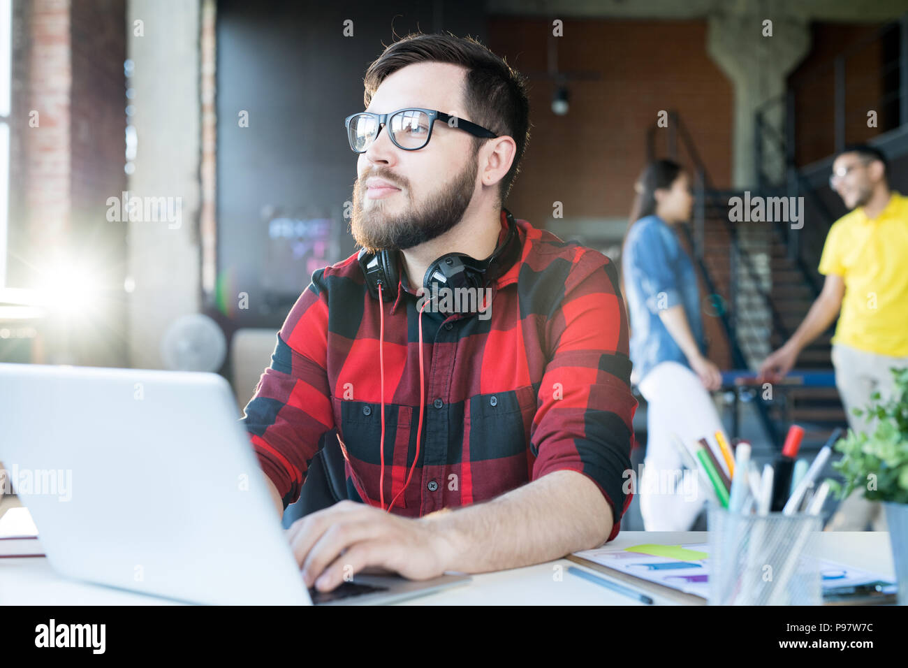 Modern Bearded Man in Coworking Space Stock Photo - Alamy