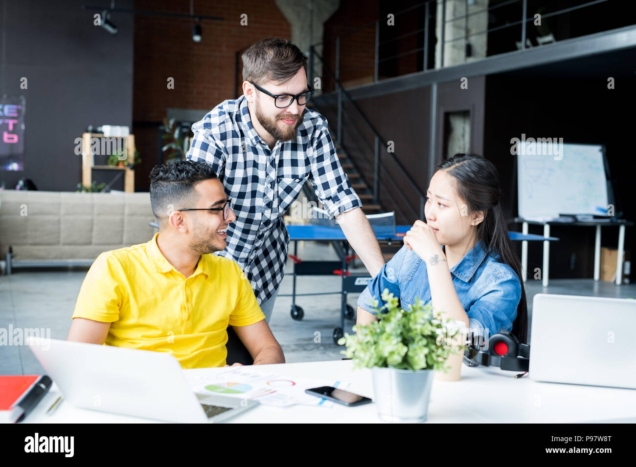 Three people chatting hi-res stock photography and images - Alamy