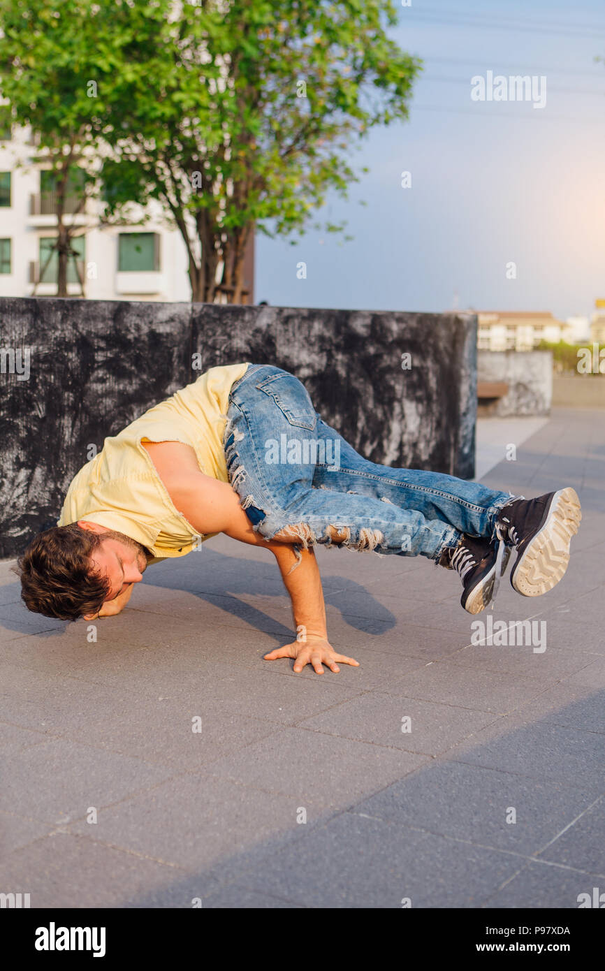 Young handsome man with beard dancing breakdance on the street Stock ...
