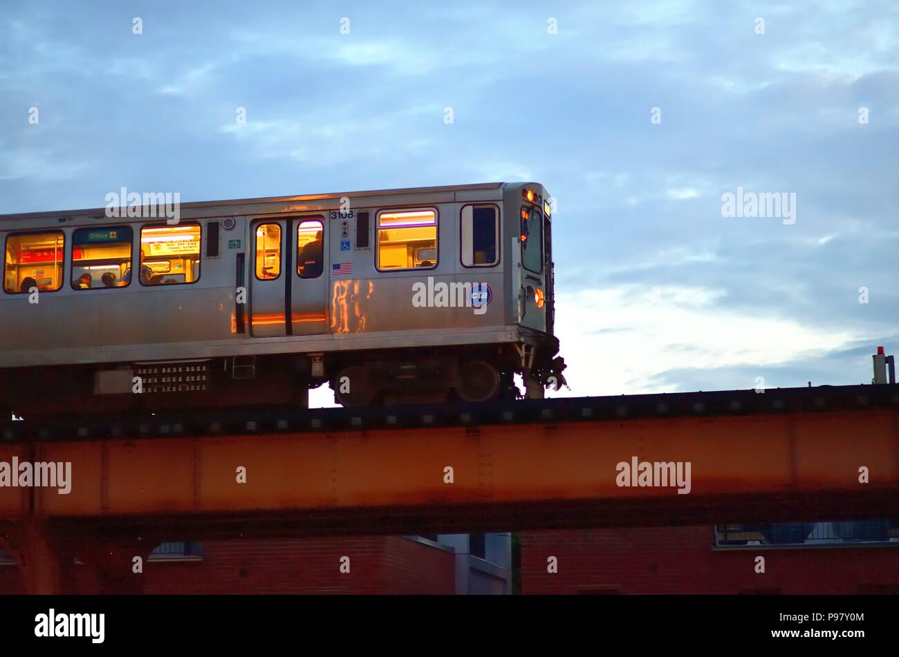 Chicago, Illinois, USA. A Blue Line train rising on an elevated ...