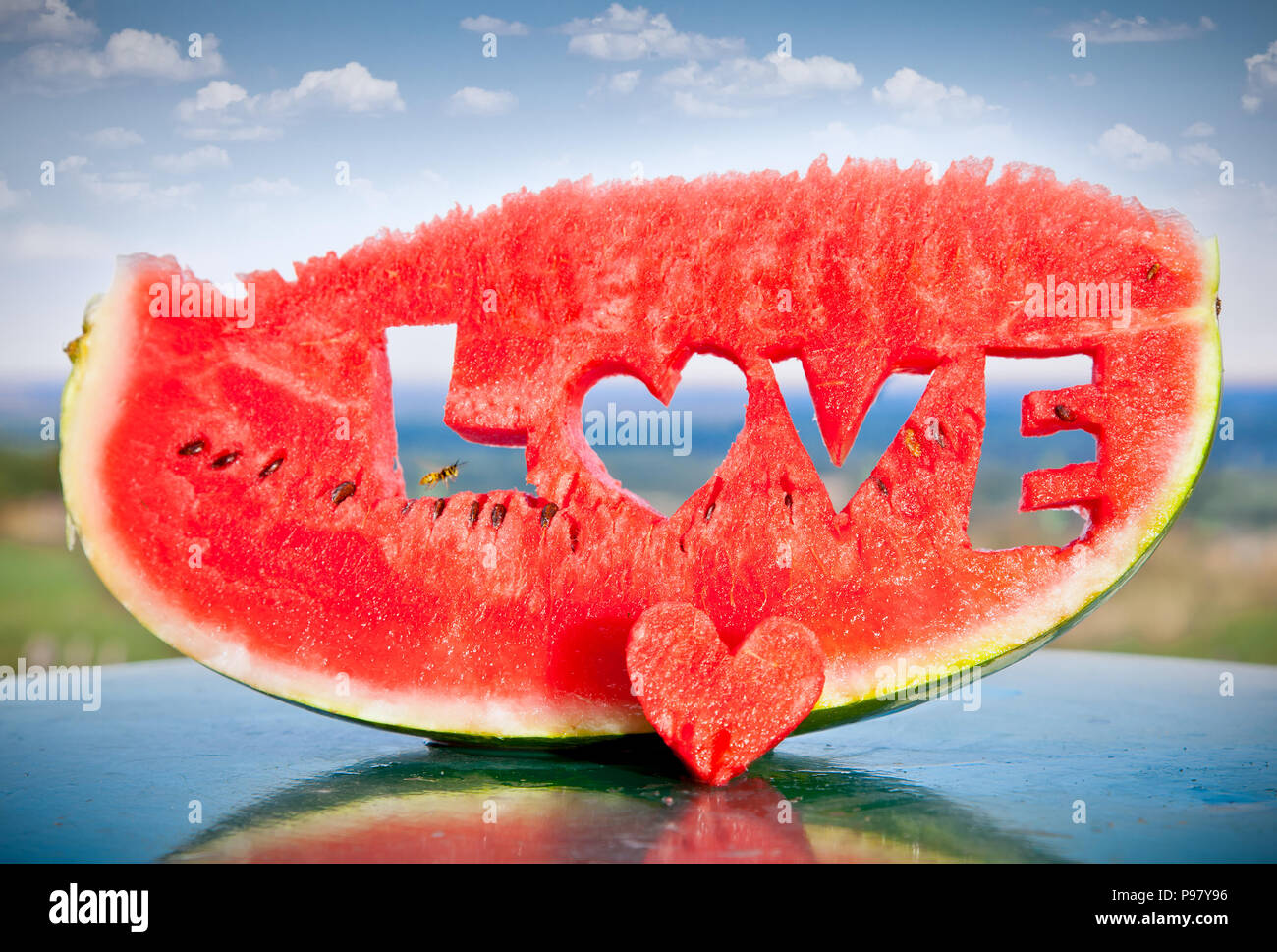 Fresh juicy watermelon slice with love letters word Stock Photo - Alamy