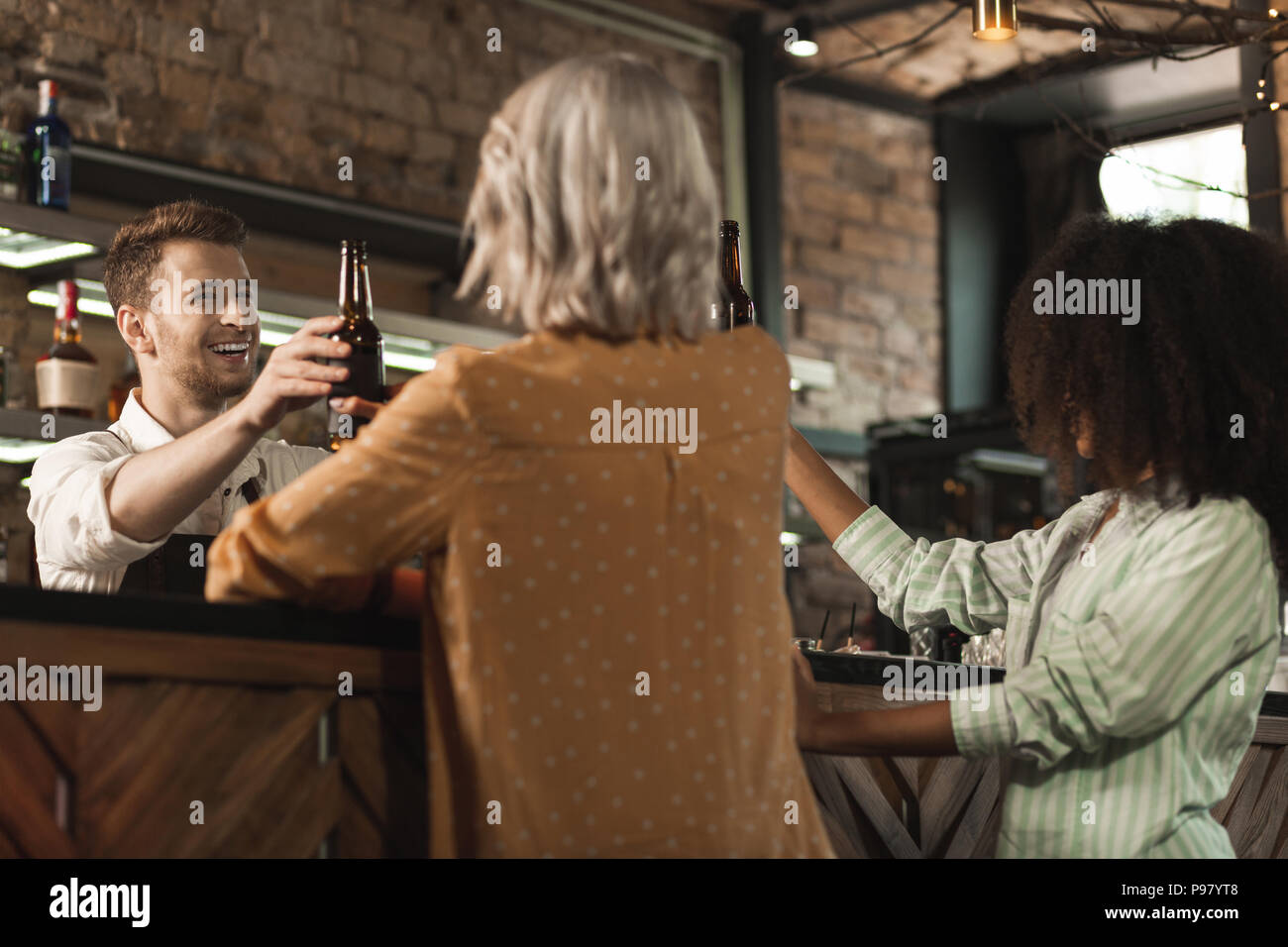 Barman giving beer hi-res stock photography and images - Alamy