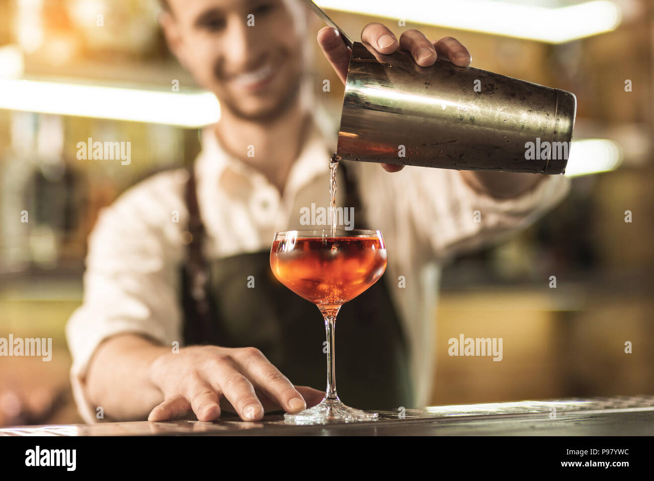 Pouring cocktail from shaker into hi-res stock photography and images ...