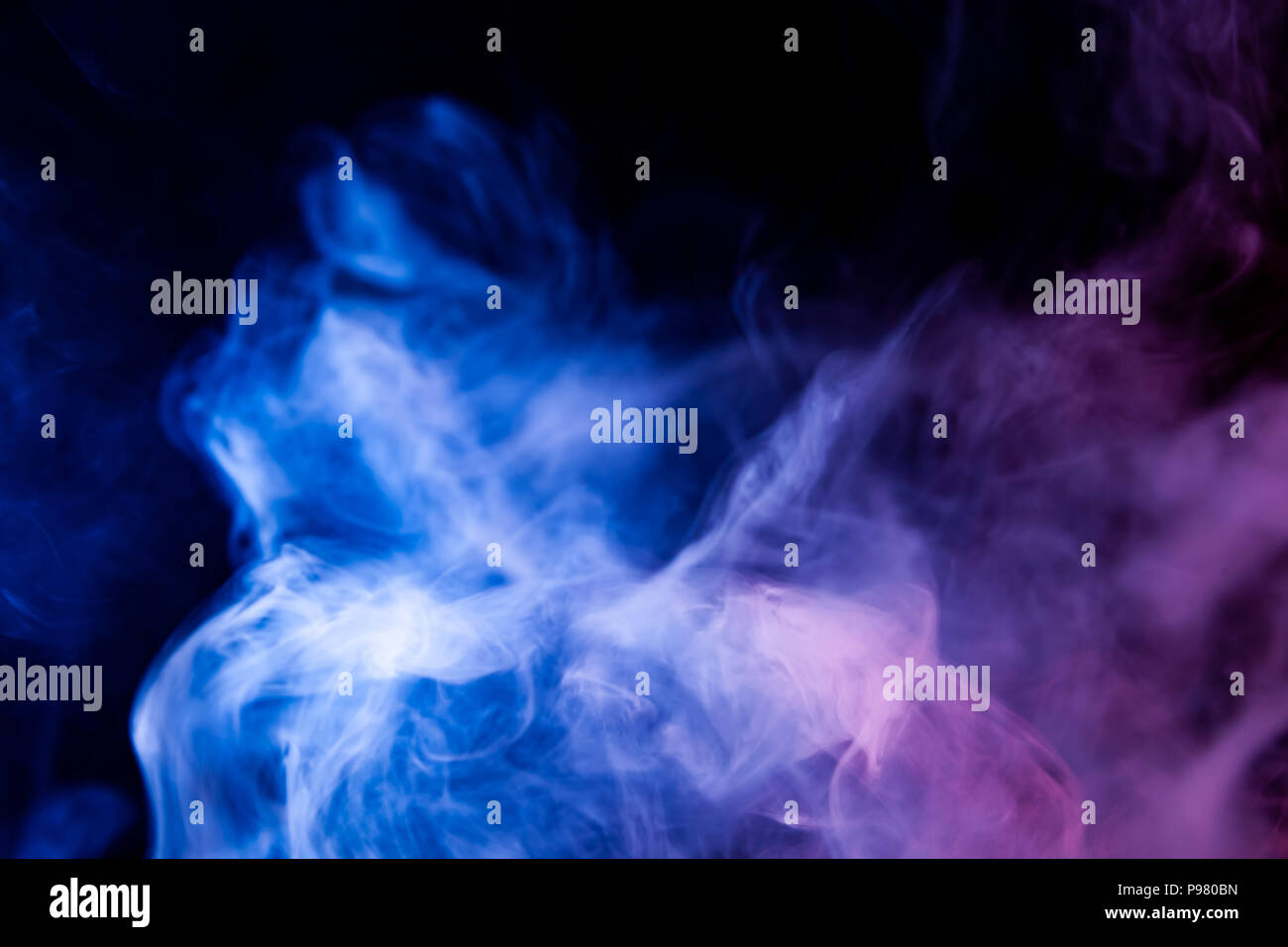 Colorful pink and blue smoke on a black isolated background. Background ...