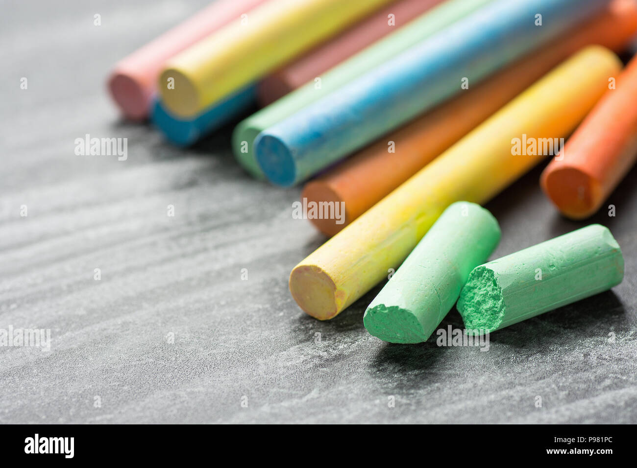 Row Pile of Multicolored Chalks Crayons on Dark Scratched Blackboard ...