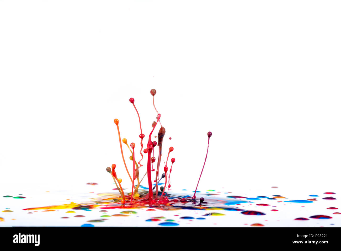 Splash of color ink on white background Stock Photo - Alamy
