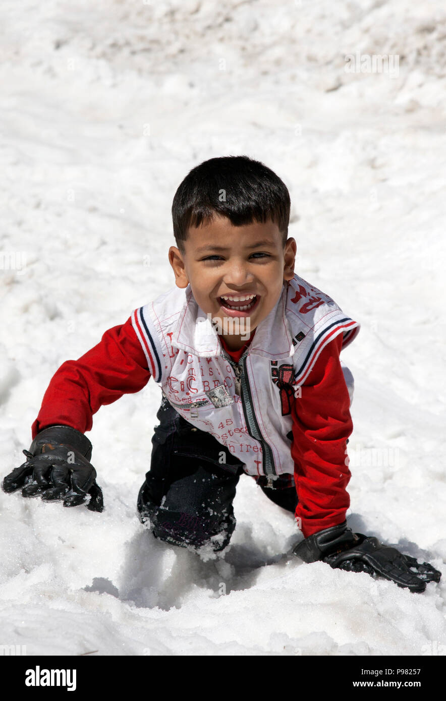 Boy in the snow Stock Photo - Alamy