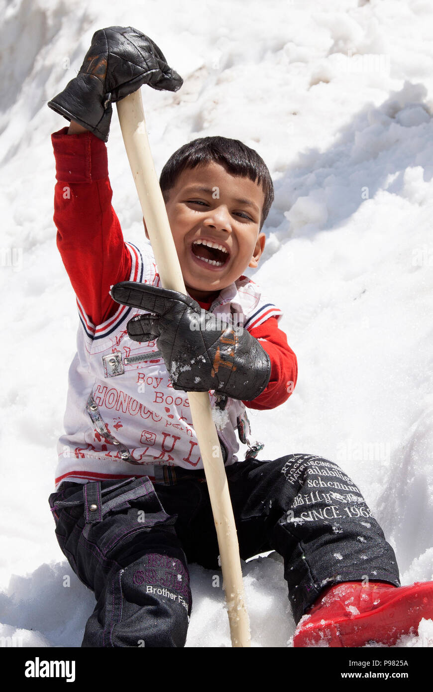 Boy in the snow Stock Photo - Alamy