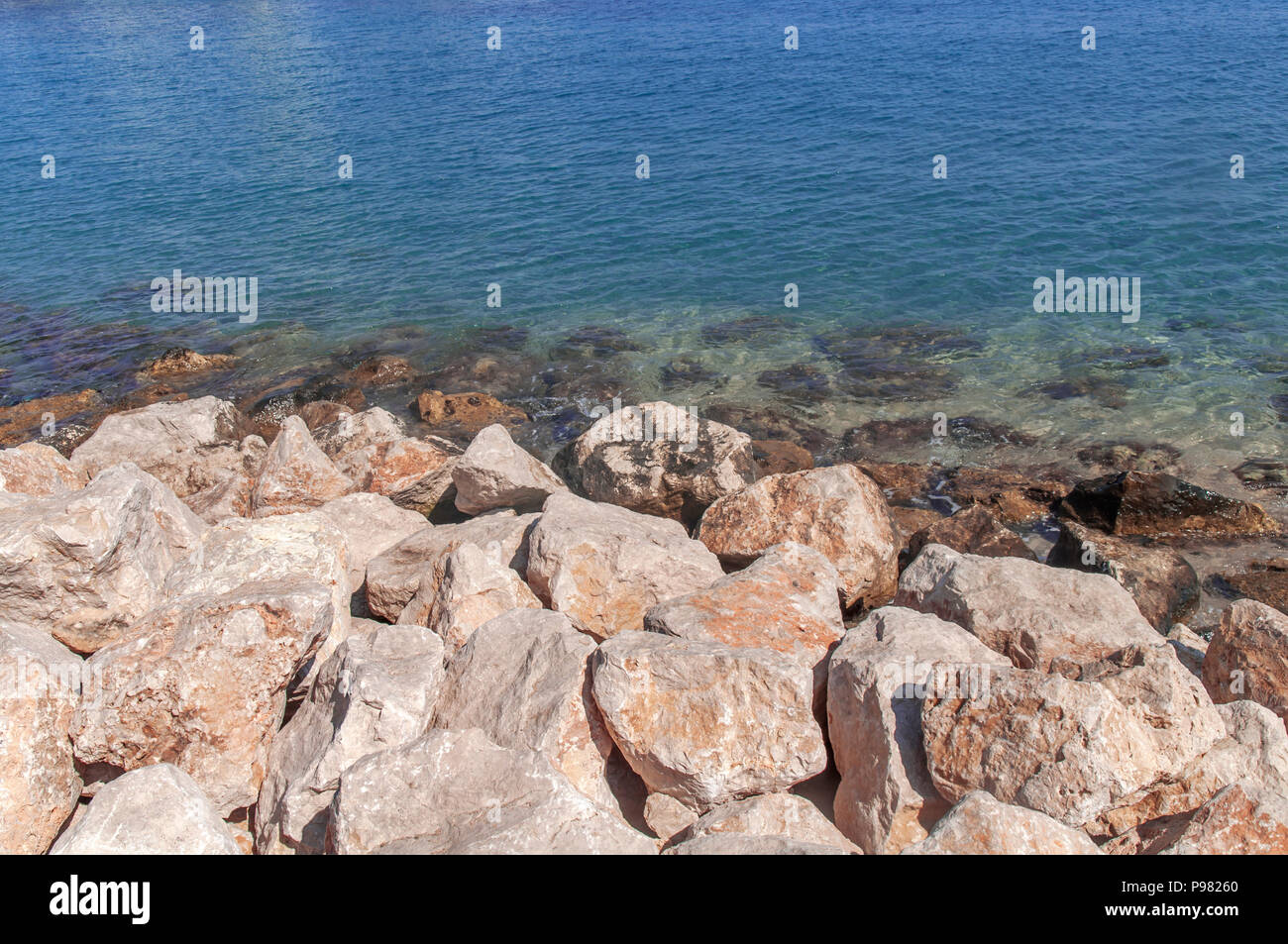 Big foreground of sea stone and blue sea background at Greek iceland ...