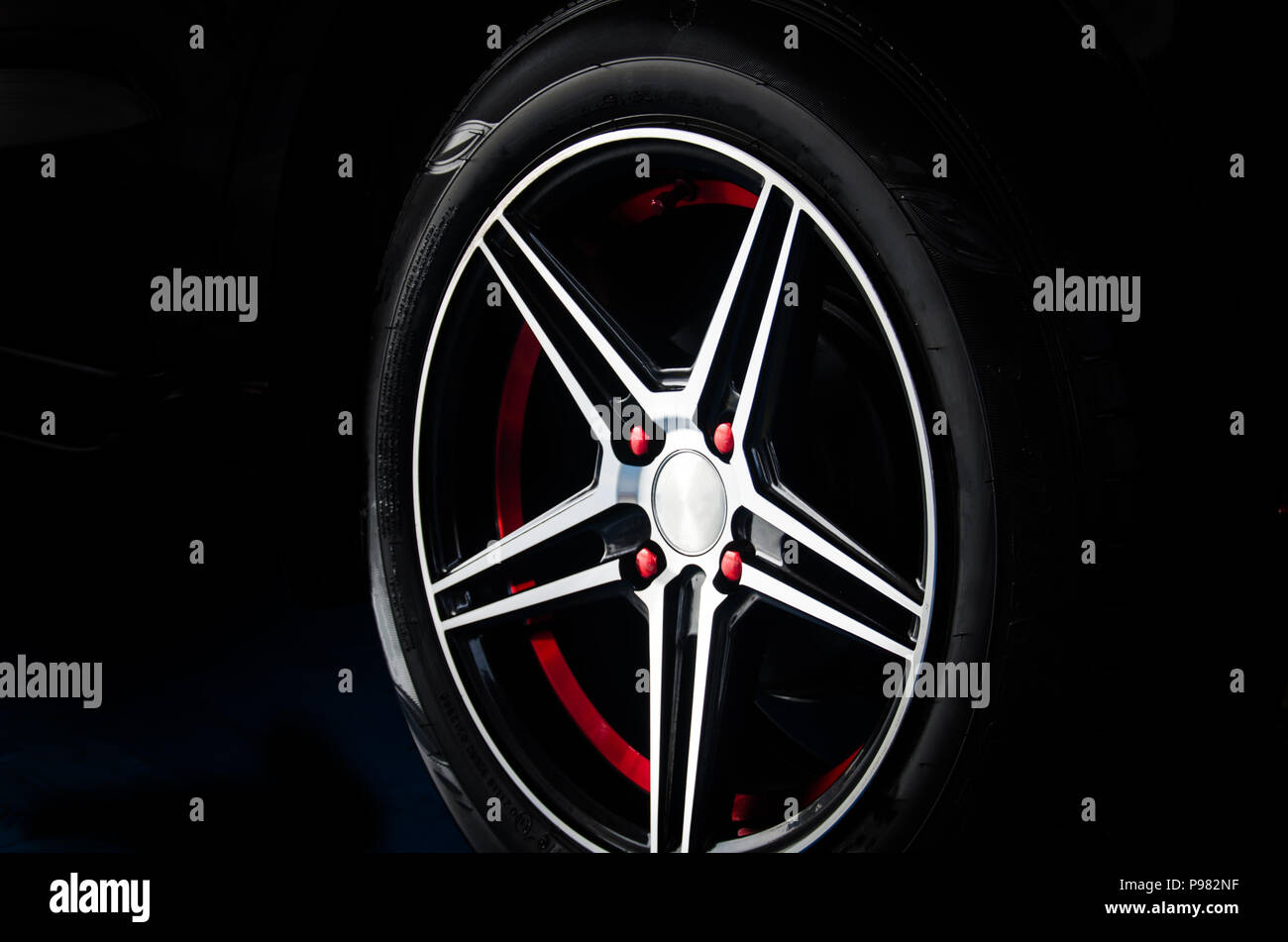 Luxury alloy wheel in close-up as an automotive Stock Photo - Alamy