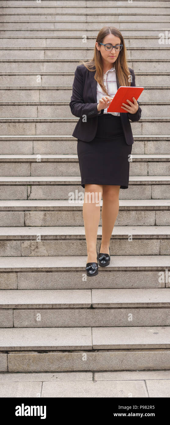 Woman descending stairs hi-res stock photography and images - Alamy