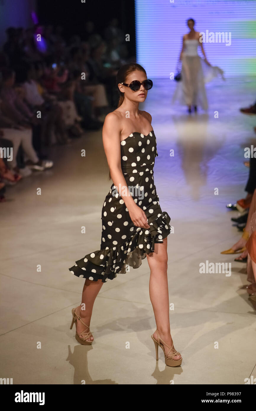Miami Beach, Florida, USA. 14th July, 2018. A model walks on the runway ...