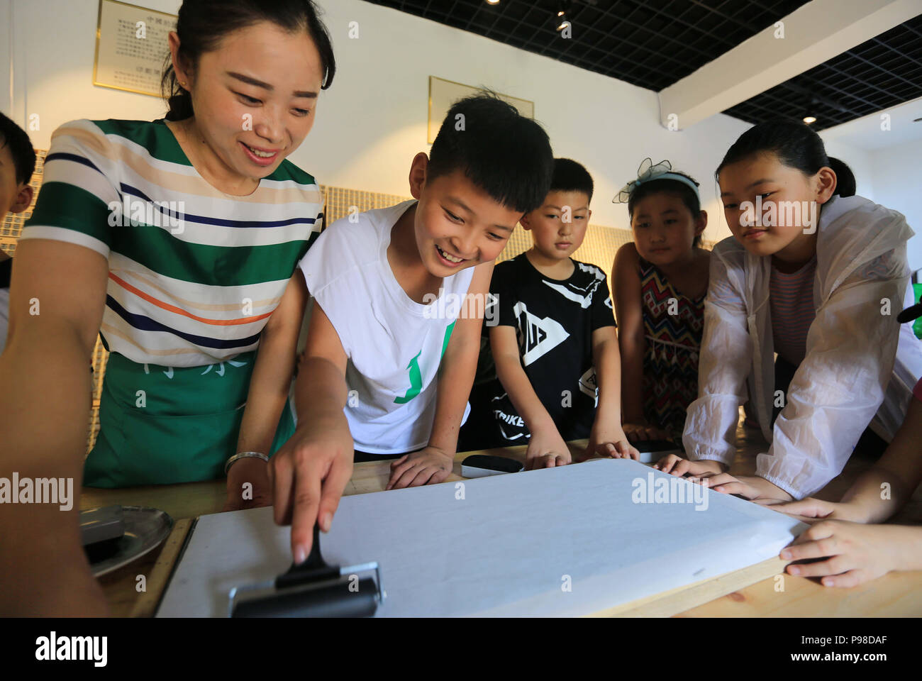 Linyi, China's Shandong Province. 16th July, 2018. Children experience typography at an ...