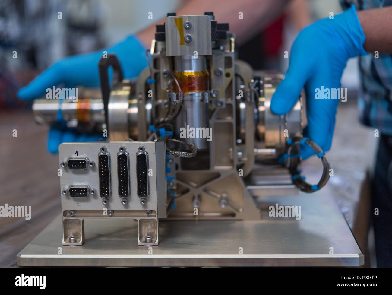 Coswig, Germany. 10th July, 2018. An employee of RUAG Space Germany ...