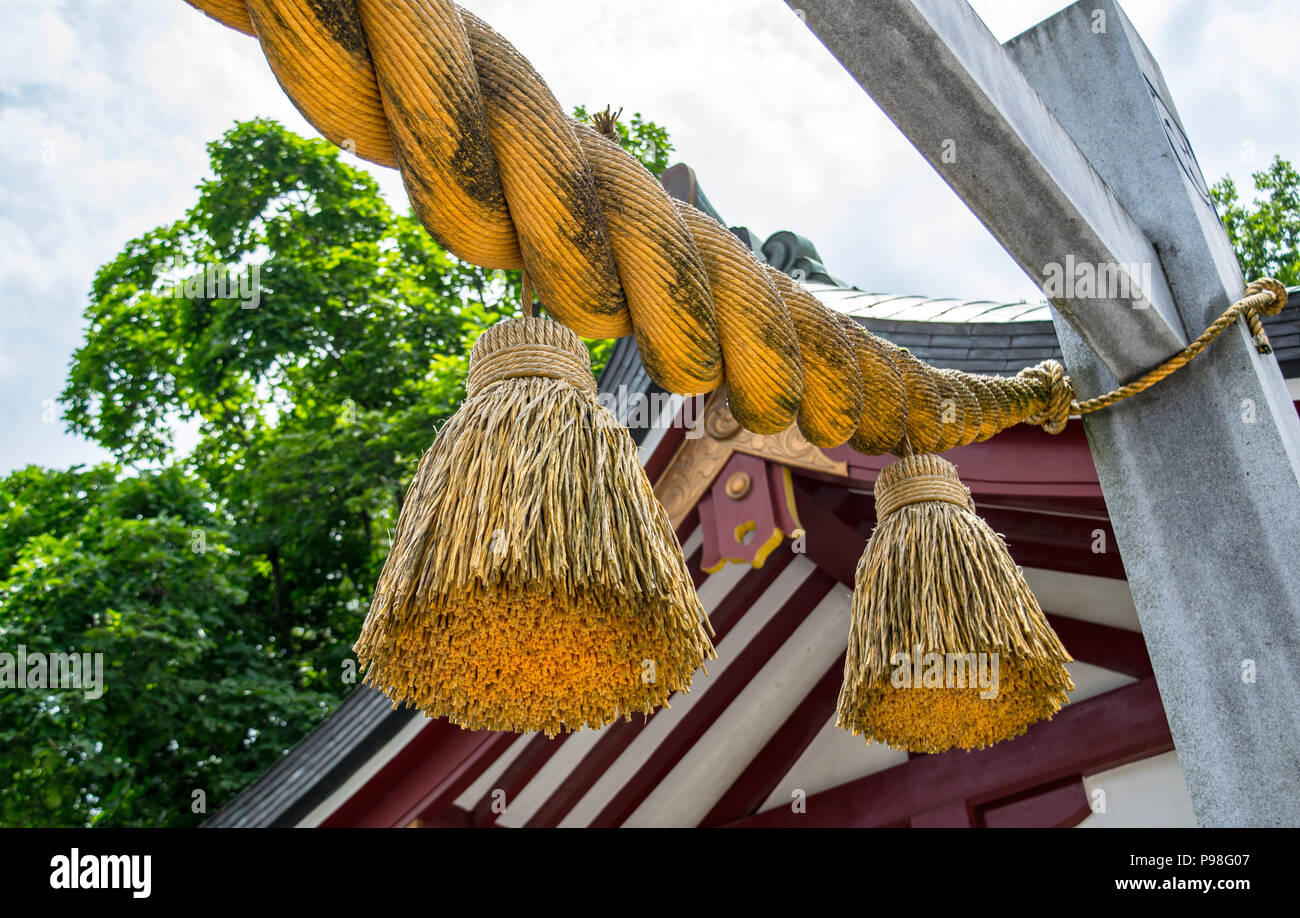 Shinto gate cord Stock Photo - Alamy