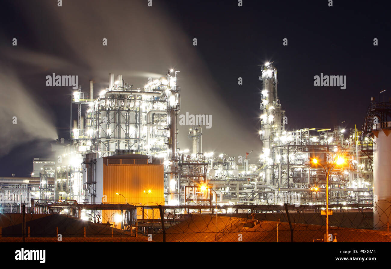 Oil refinery at night Stock Photo - Alamy