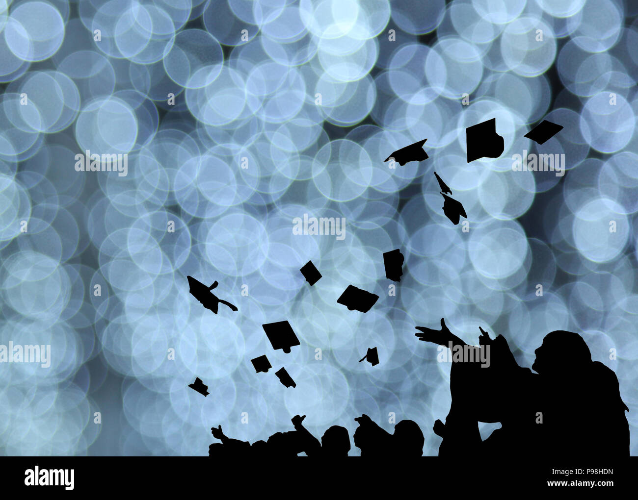 Silhouette of Graduate Students throw mortarboards in university ...