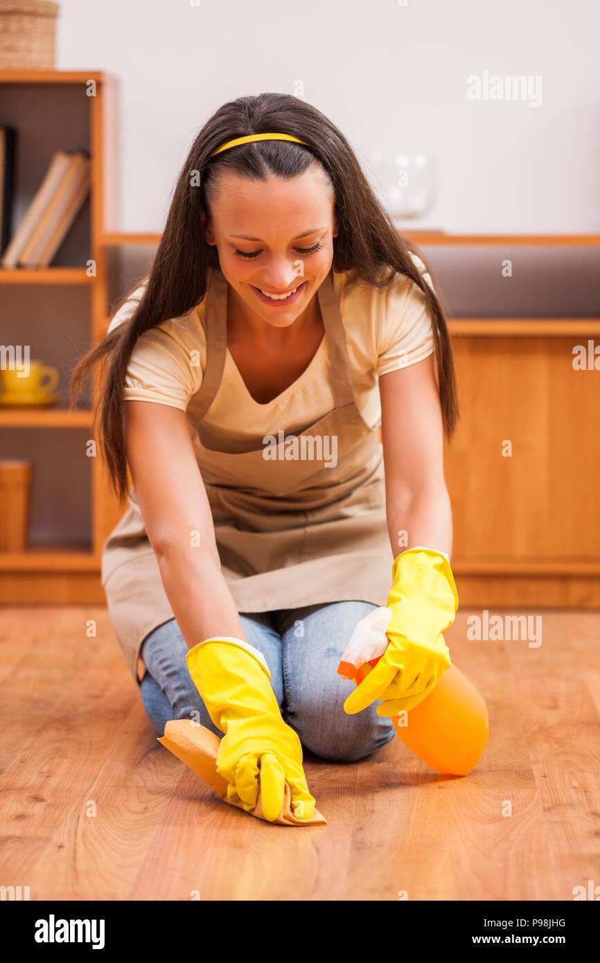 Young happy woman is cleaning the house Stock Photo - Alamy