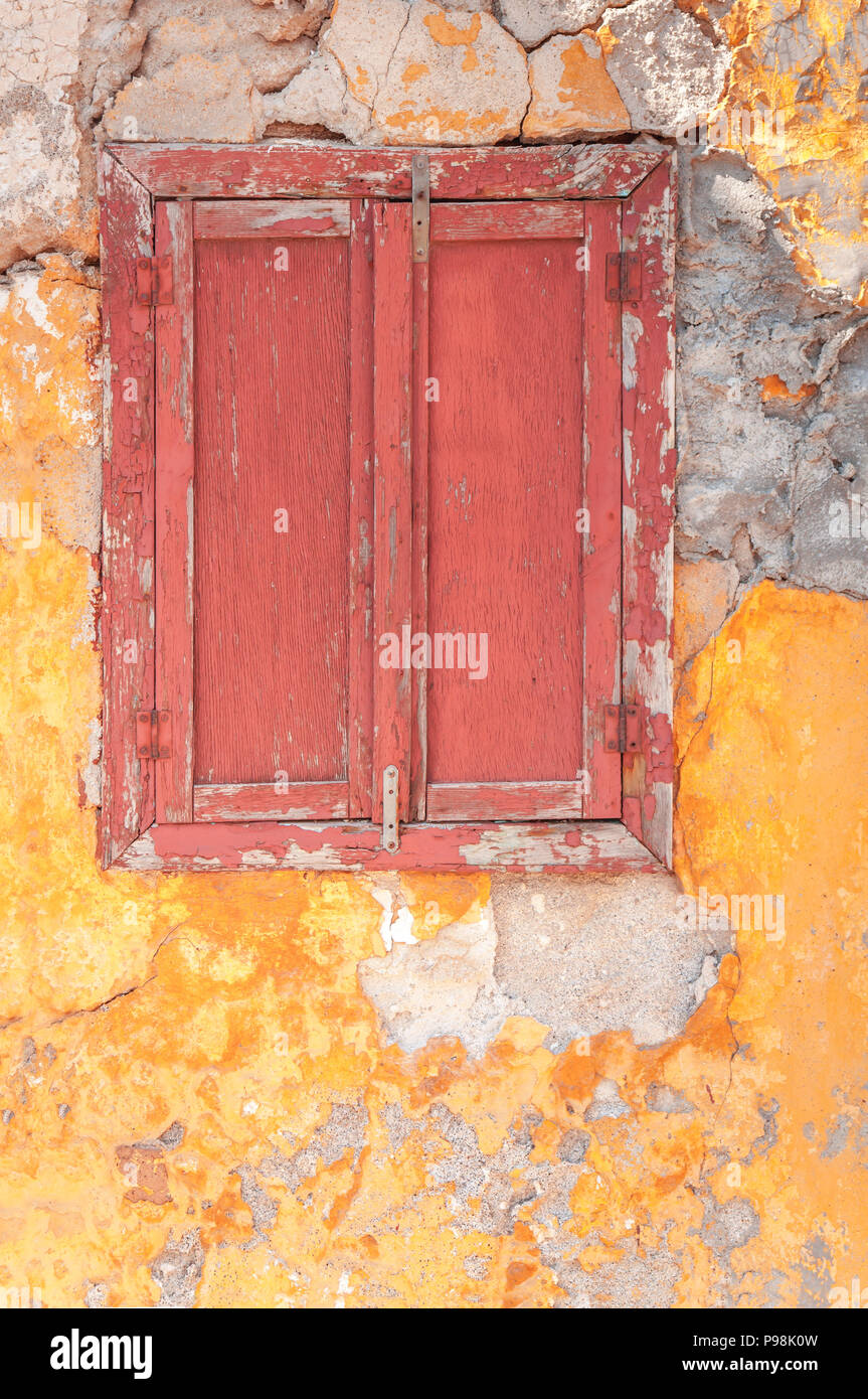Old dark red wooden window on concrete broken textured house wall Stock ...