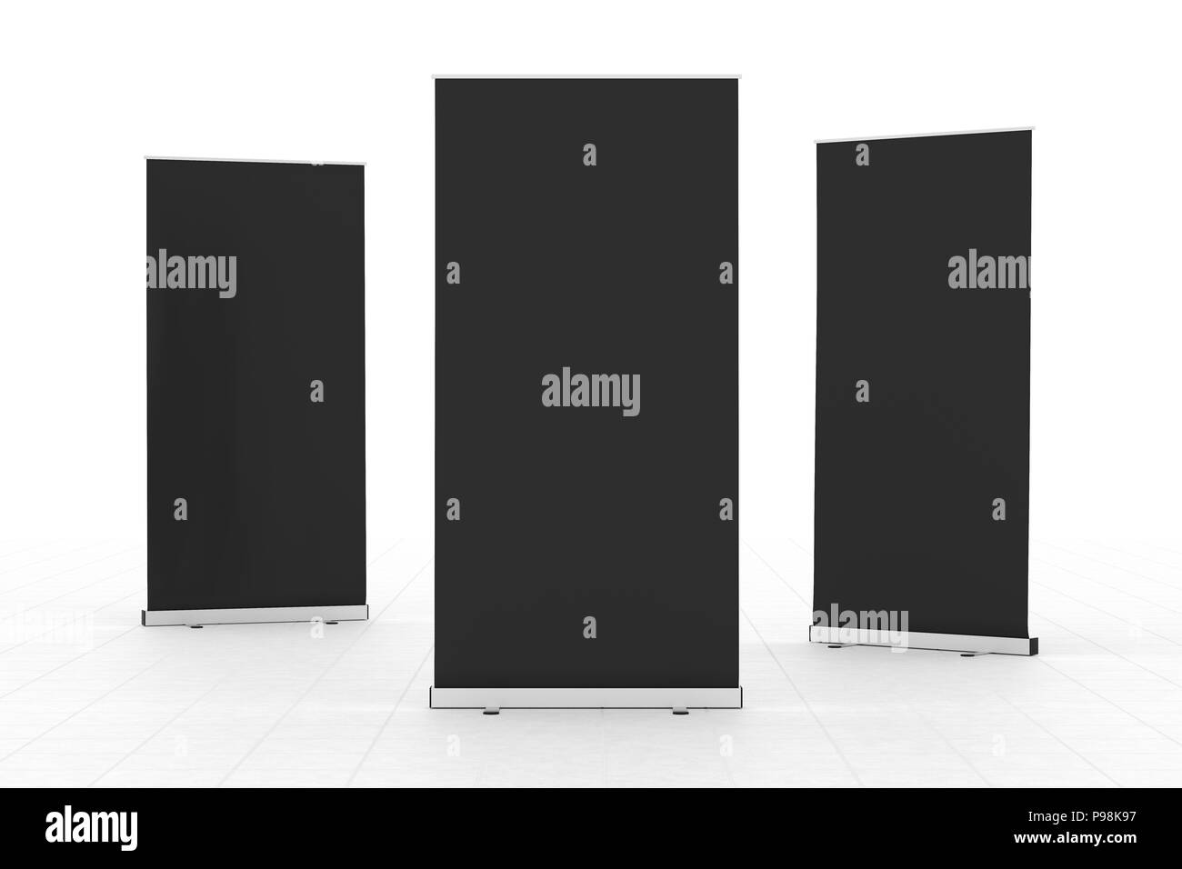 Blank black roll-up banners stand isolated on white floor. Include ...