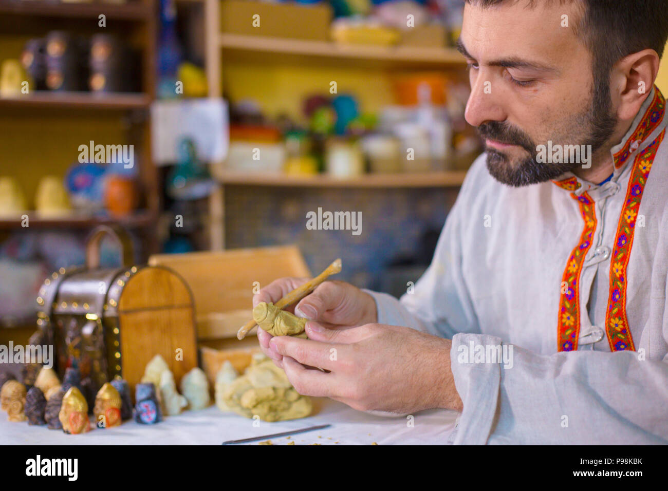 Potter making clay figure for board game Stock Photo - Alamy