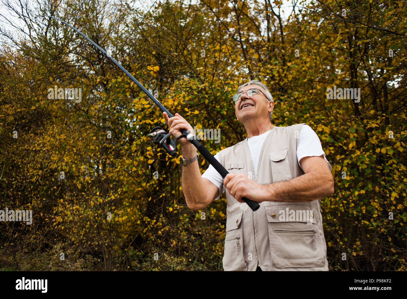 Fisherman casting a hook Stock Photo - Alamy