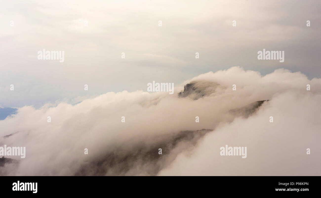 rain clouds and fog in the mountain of Ceahlu, Romania Stock Photo - Alamy