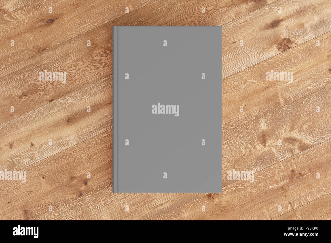 Blank gray book cover on wooden background. Isolated with clipping path ...