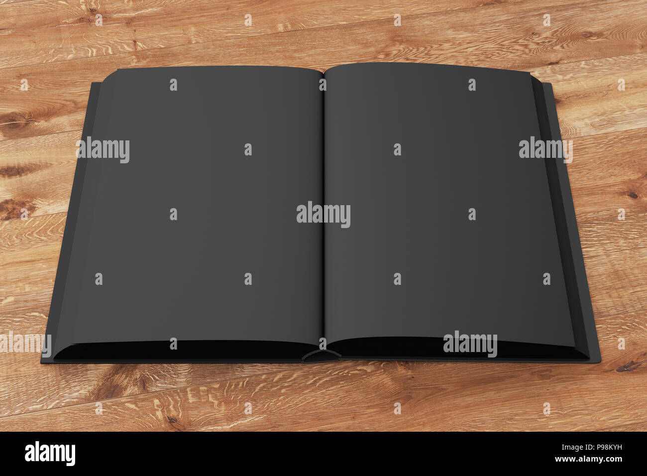 Open book with black cover and pages isolated on wooden background ...