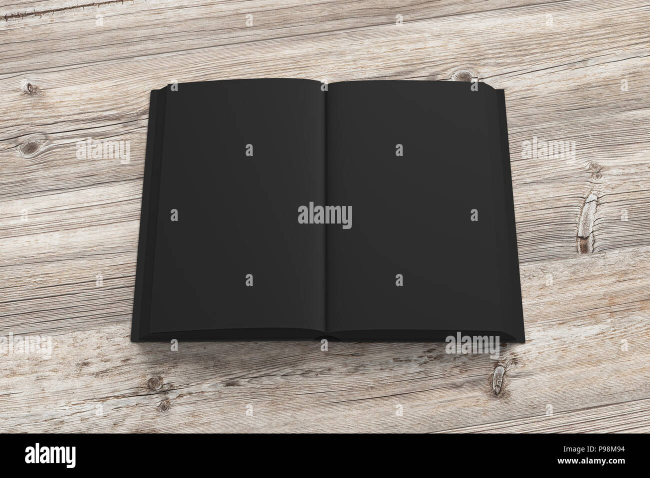 Open book with black cover and blank black pages isolated on wooden ...