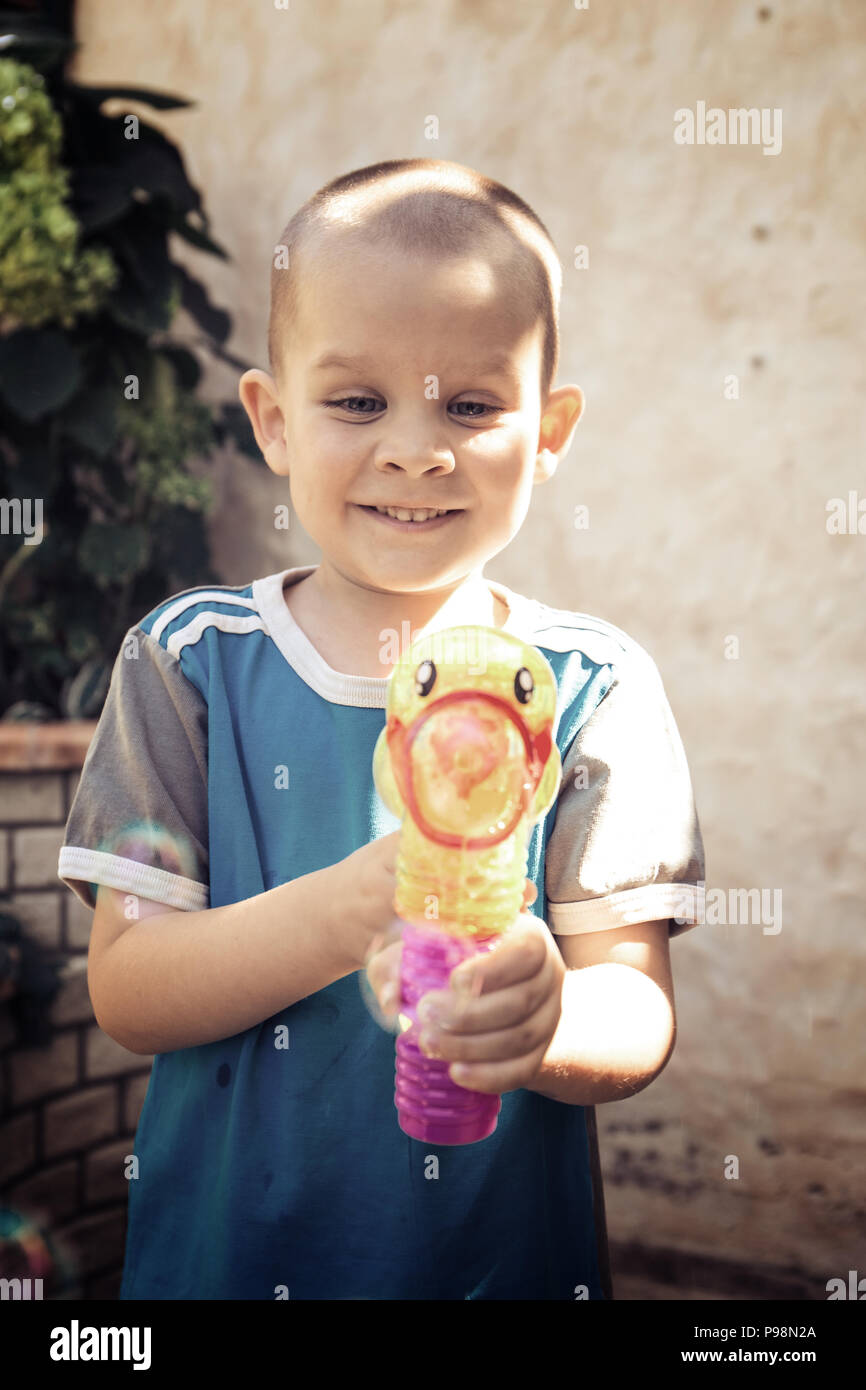 little boy doing soap bubbles Stock Photo - Alamy