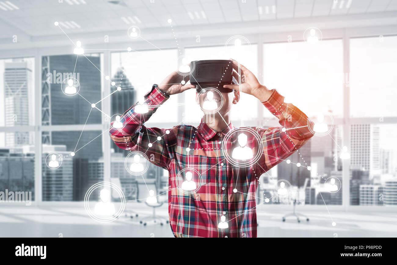 Guy wearing checked shirt and virtual mask demonstrating some emotions ...