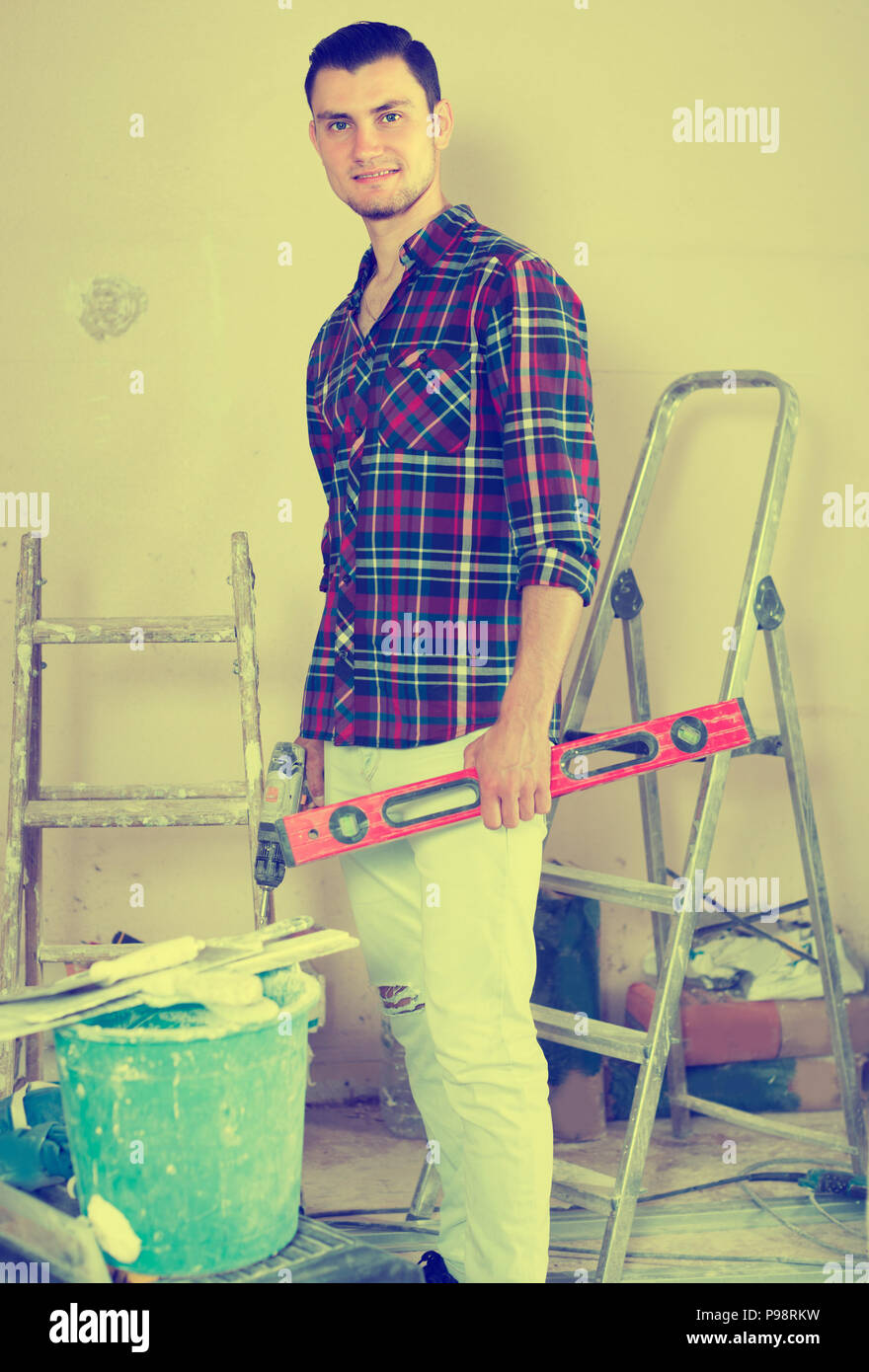 Portrait of smiling man which is ready for his house renovation Stock ...