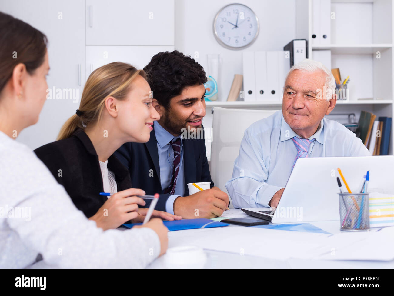 Employees are working together at computer in the office Stock Photo ...