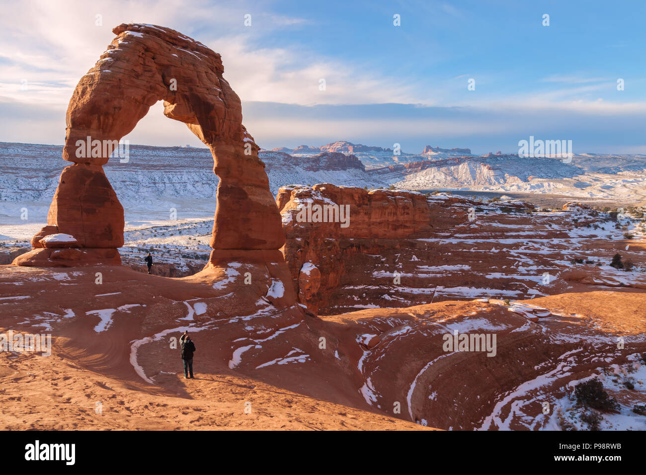Tourist were taking pictures at the iconic Delicate Arch in Arches ...