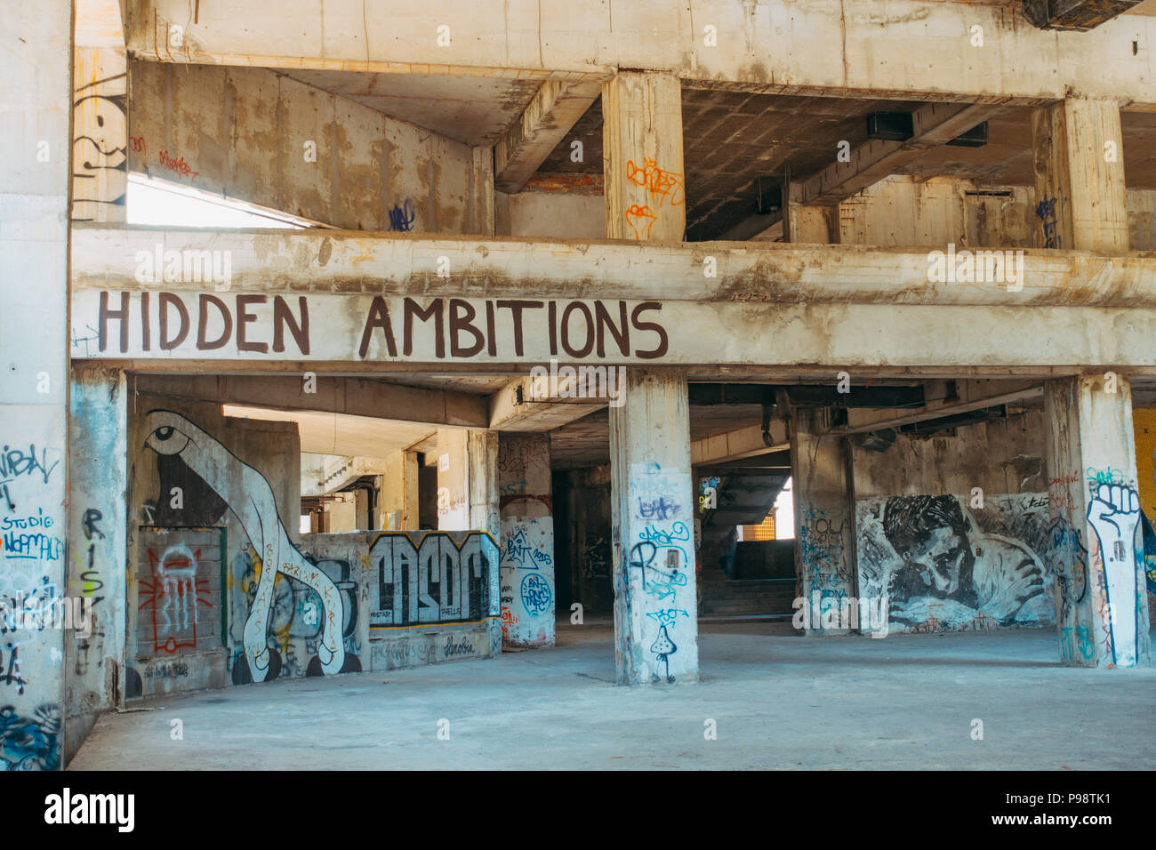 graffiti art "Hidden Ambitions" inside an abandoned concrete building ...