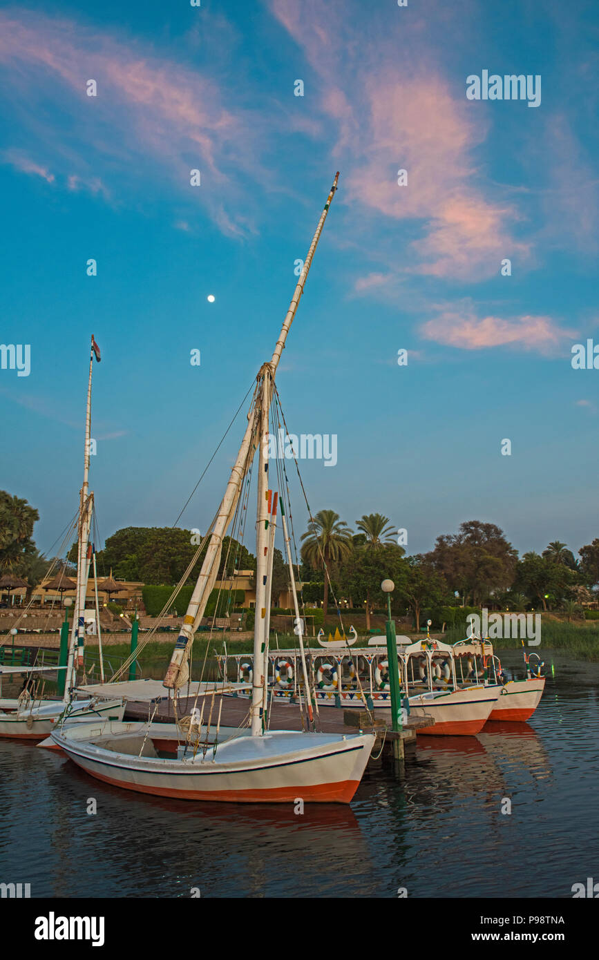 Tranquil small boats moored at jetty hi-res stock photography and ...