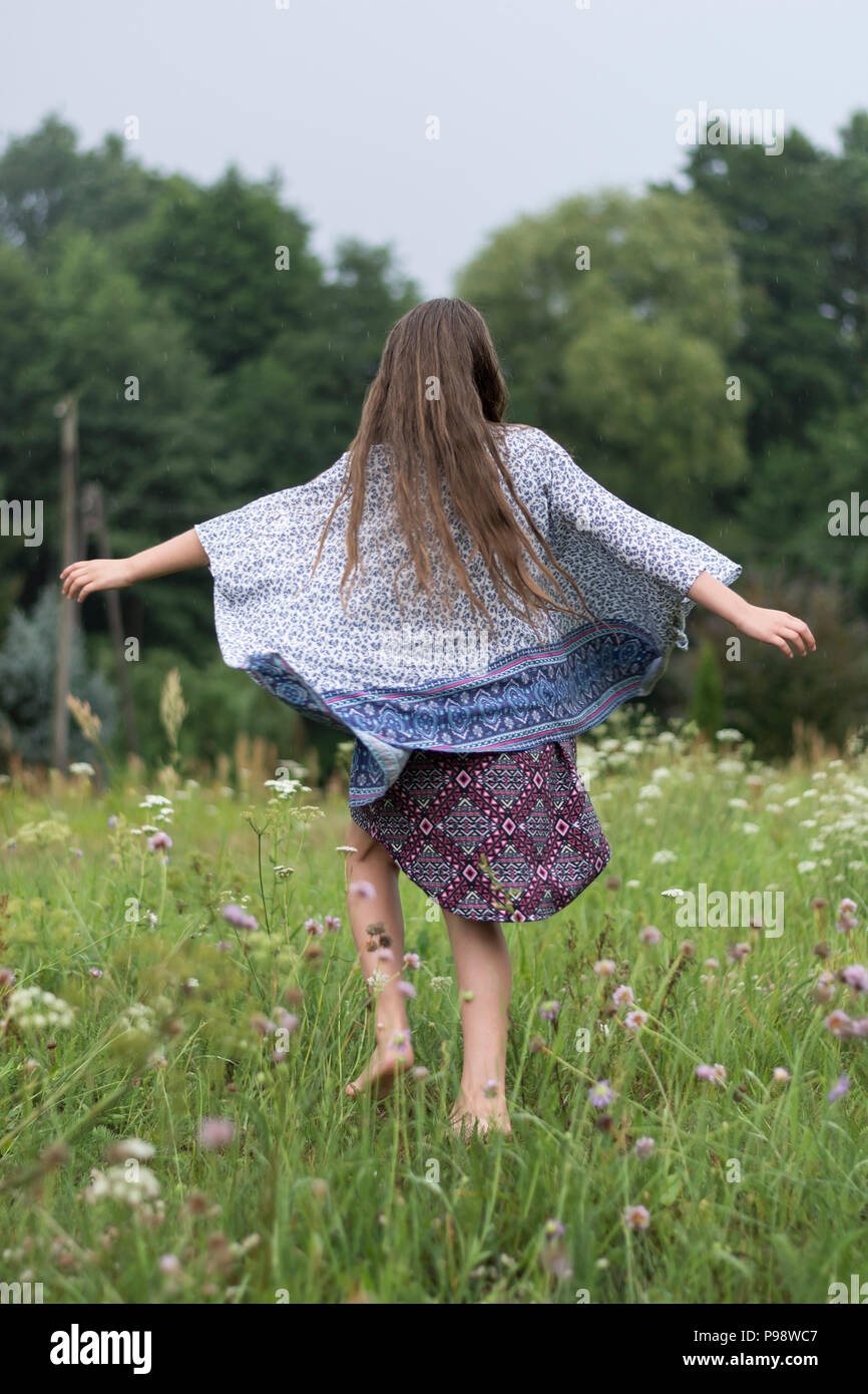 Happy Girl Dancing In The Rain