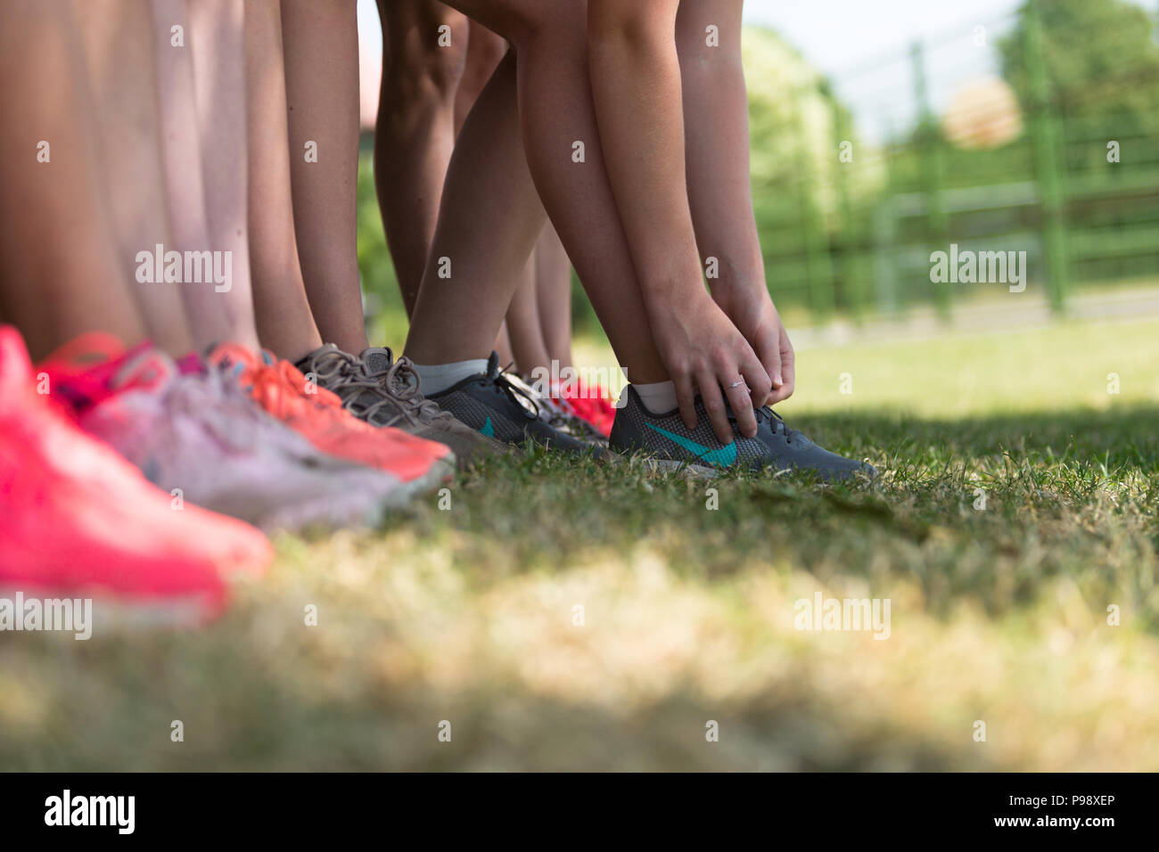 Teenaged girls 11 - 16 in school PE lesson showing footwear and legs UK ...