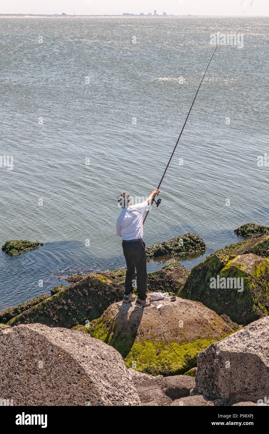 Man catching fish hi-res stock photography and images - Alamy