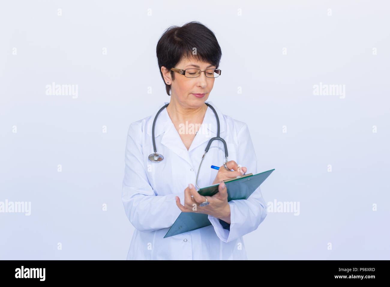 Medical doctor writing prescription over white background Stock Photo ...