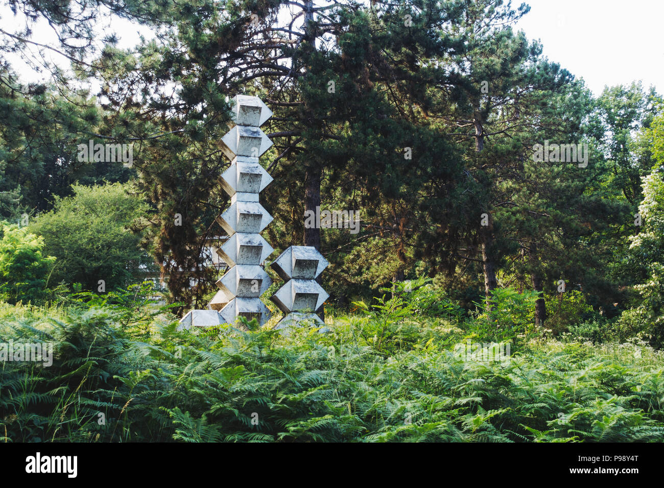 An obscure monument in the forest at the entrance to a campground in ...