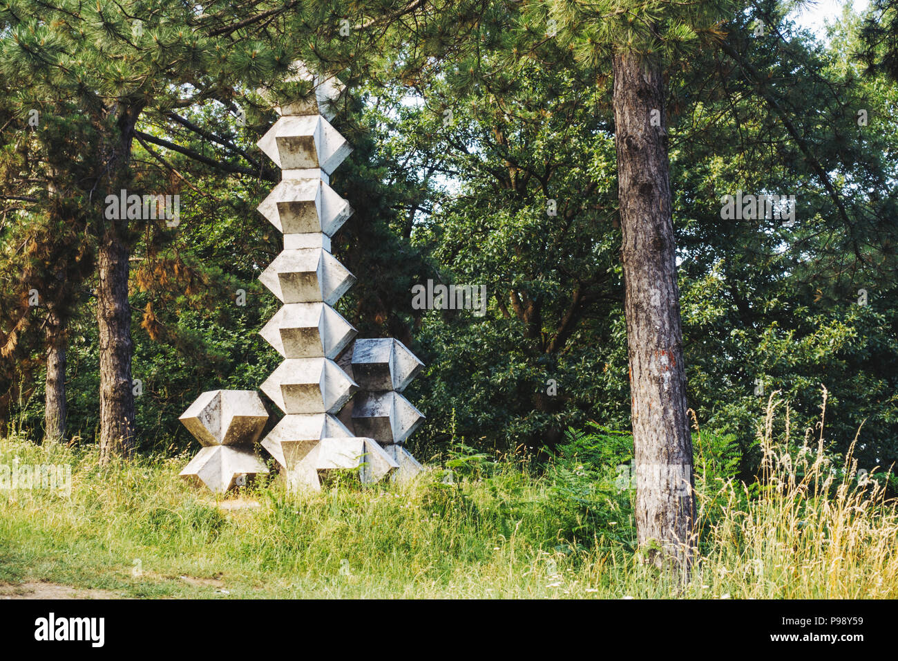 An obscure monument in the forest at the entrance to a campground in ...