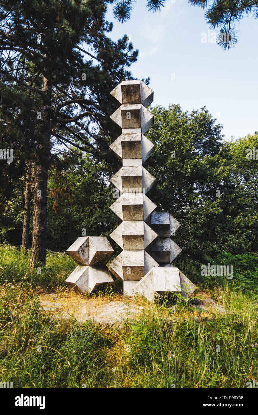 An obscure monument in the forest at the entrance to a campground in ...